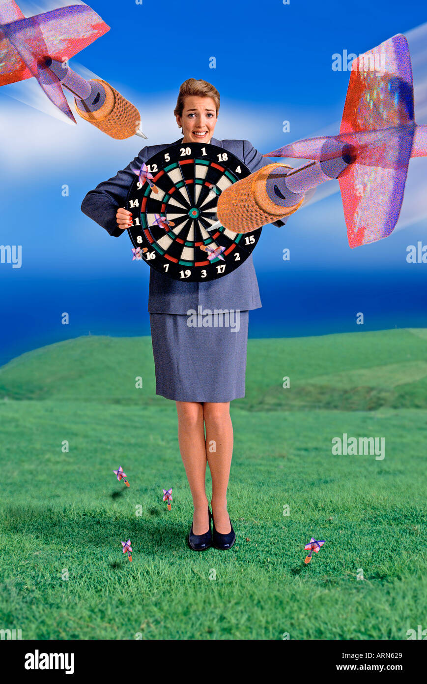 Woman holding Dartboard in front of face Stock Photo - Alamy