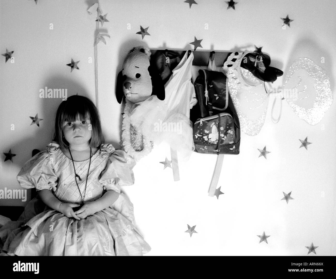 Young Girl Playing with Dressing up Clothes Stock Photo - Alamy