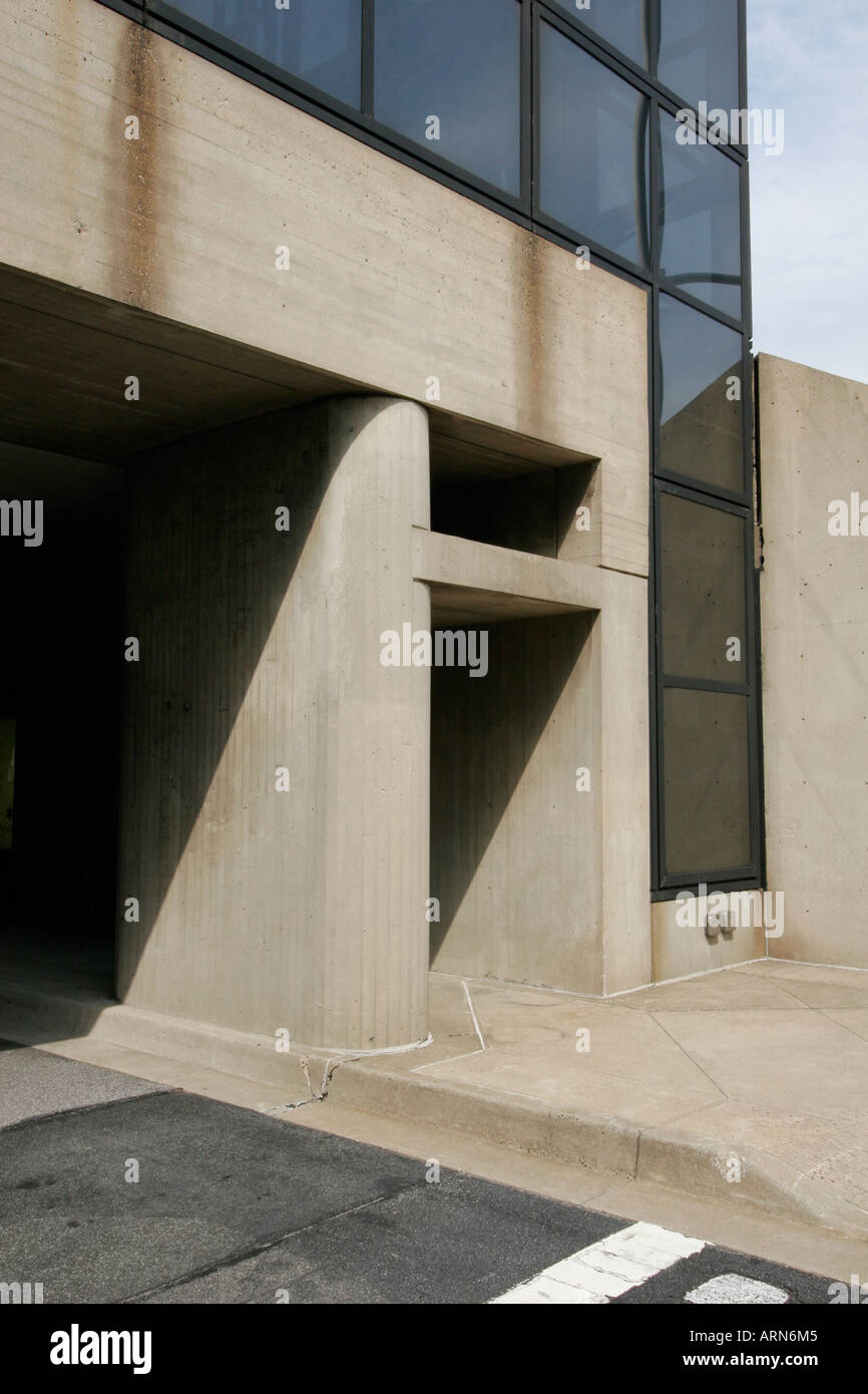 Entrance way into a concrete and glass building Stock Photo - Alamy