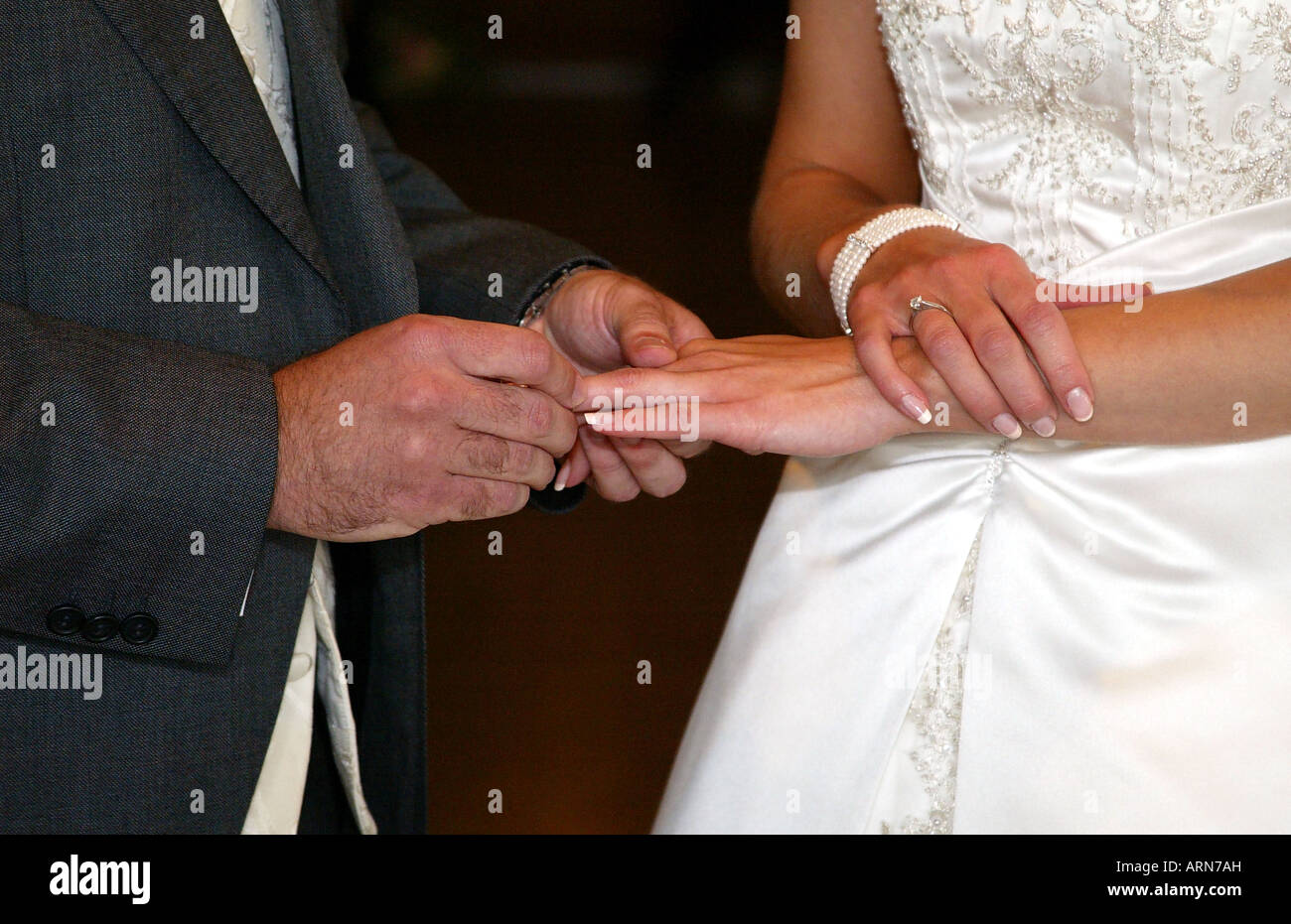 Closeup of a bride and groom at their Civil wedding during the ring ...