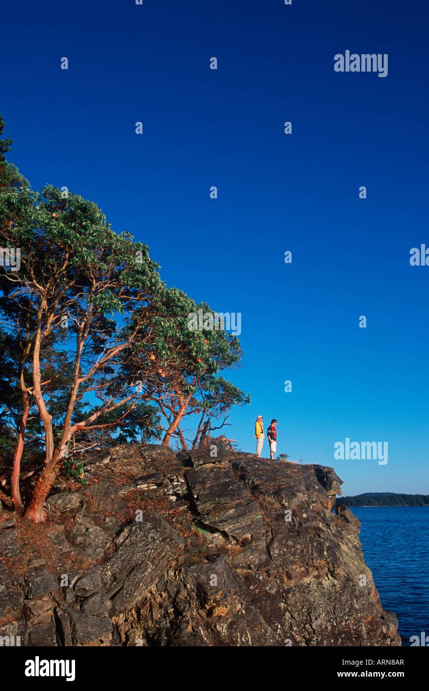 hikers on knoll, Russell Island , Gulf Islands National Park, near ...