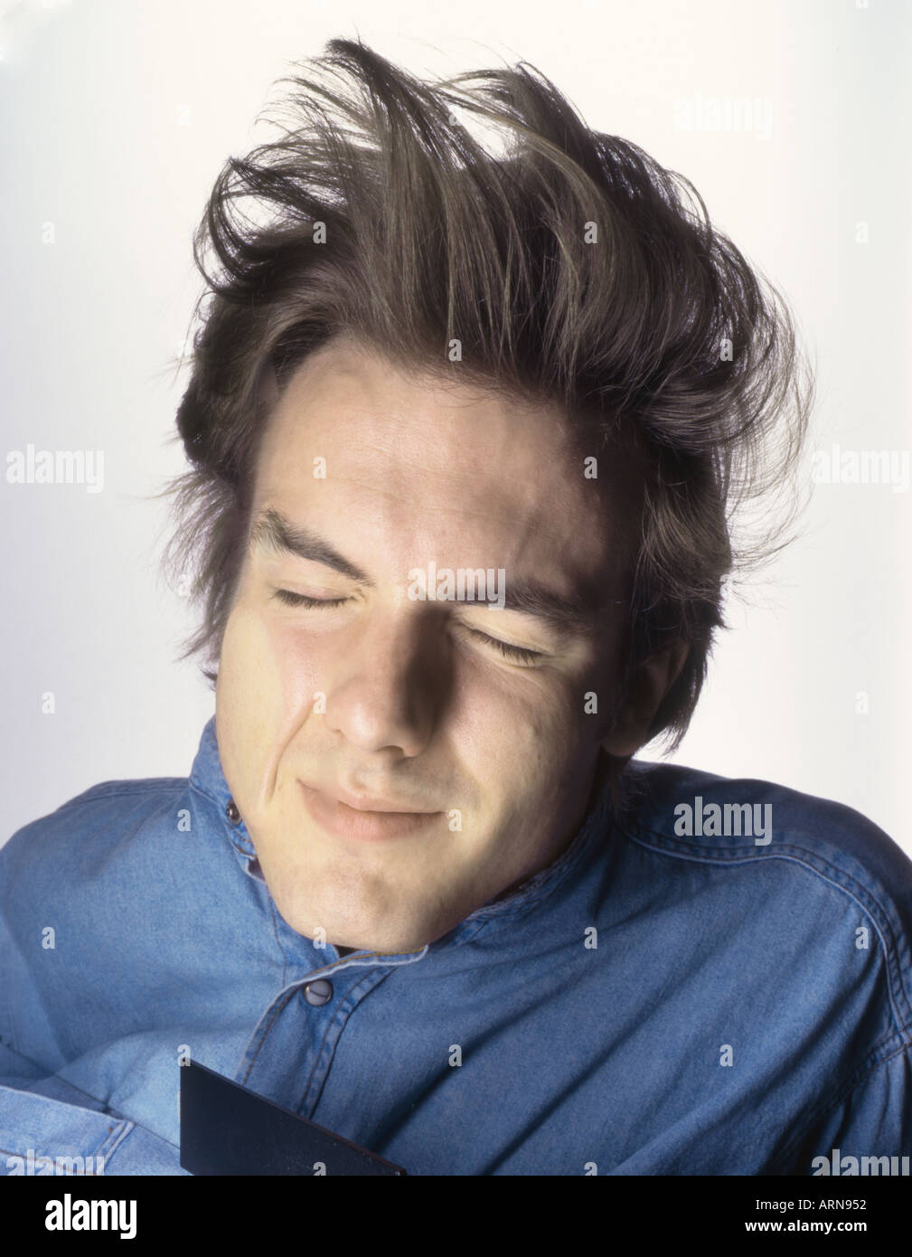 hair flung up and cheek squashed as if hit in face Stock Photo - Alamy