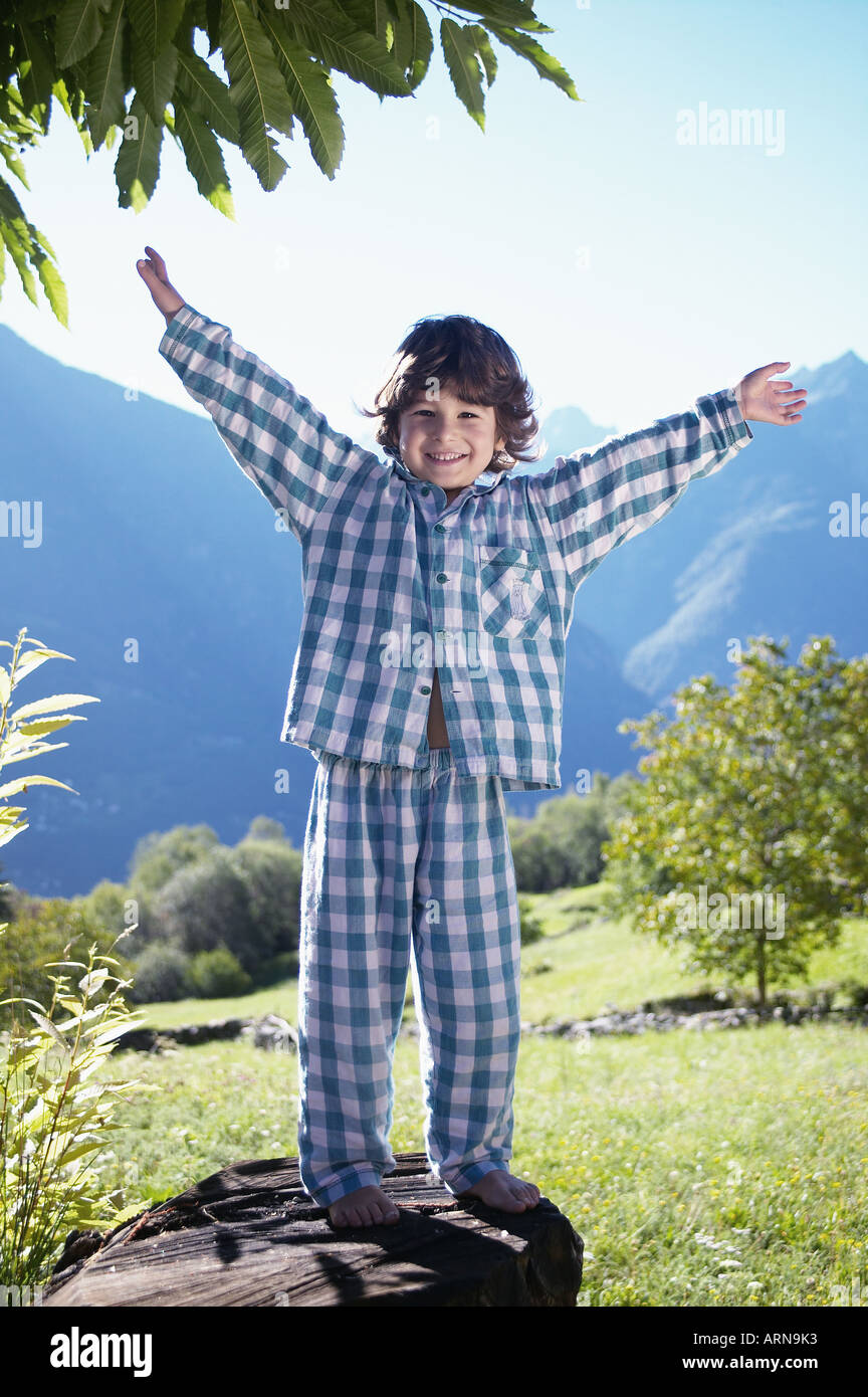 Good morning-young boy with hands up greeting the day Stock Photo - Alamy