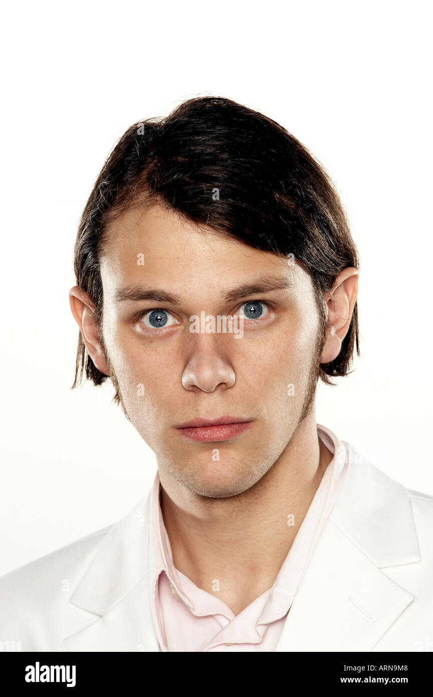 Young business mann staring into camera Stock Photo - Alamy