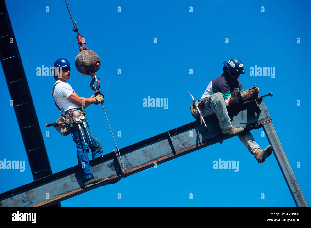 Steel workers construct a high rise building, British Columbia, Canada ...