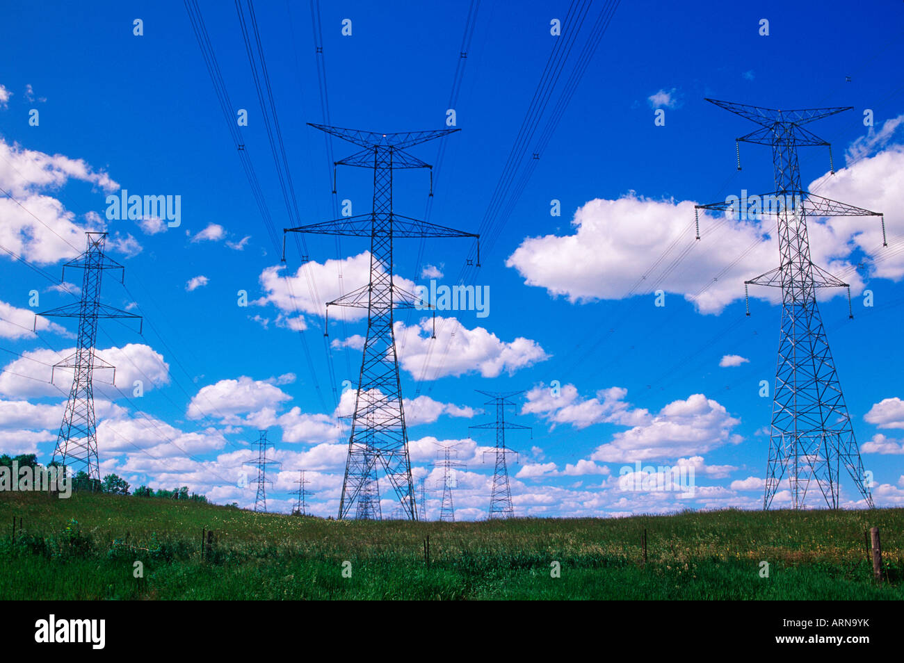 Hydro transmission towers - cumulus cloud background, British Columbia ...