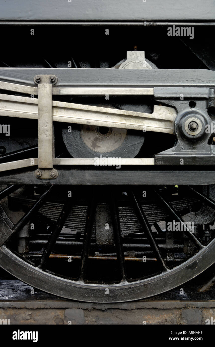Steam engine detail side view of big metal wheel Stock Photo - Alamy