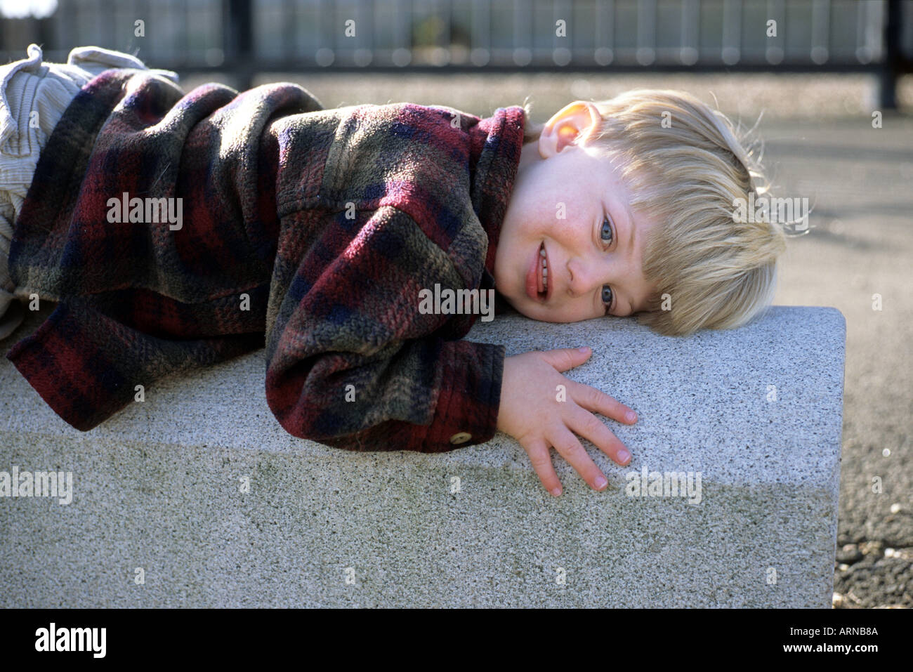 Child laying down playing Boy 2 3 years old Stock Photo - Alamy