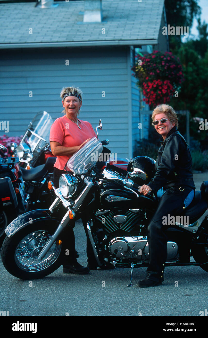 Female motorcycle riders at stop hi-res stock photography and images ...