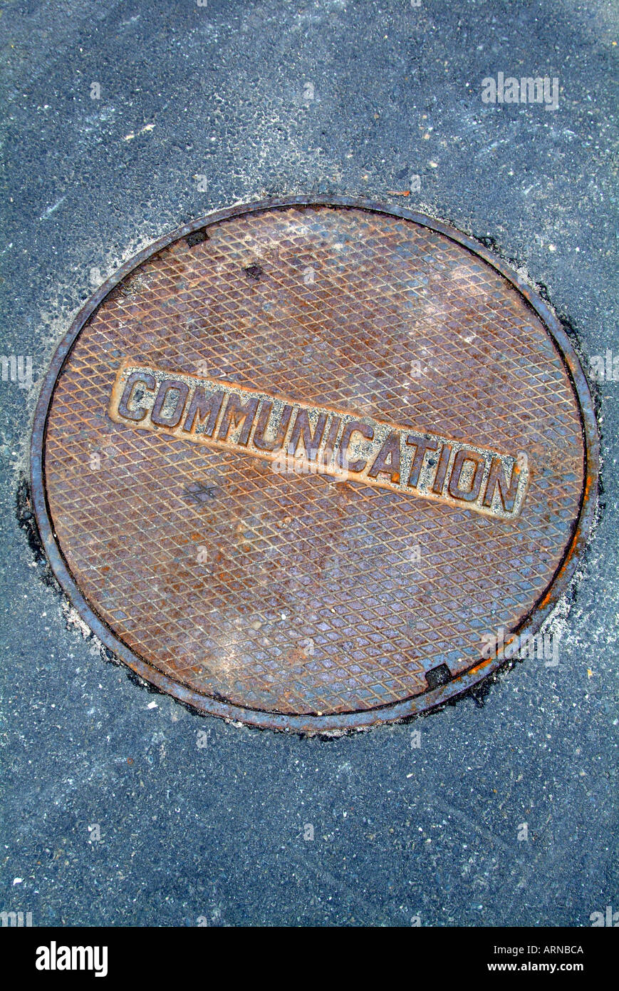 Communication on Manhole cover Stock Photo - Alamy