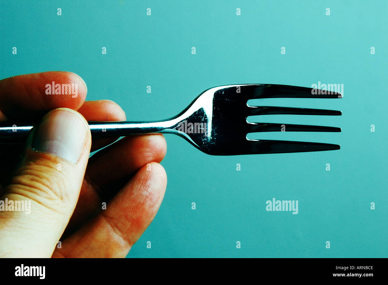 Hand and fork hi-res stock photography and images - Alamy