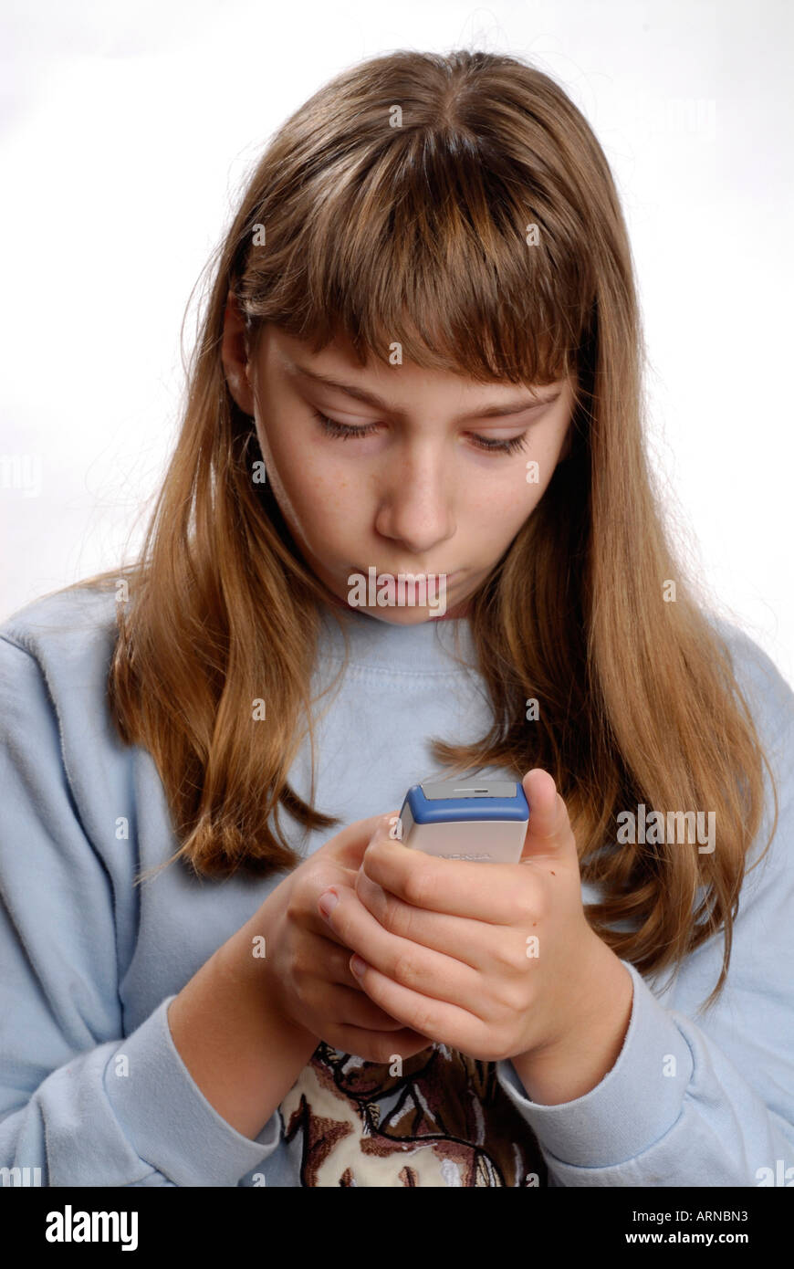 Girl telephones with mobile phone Stock Photo - Alamy