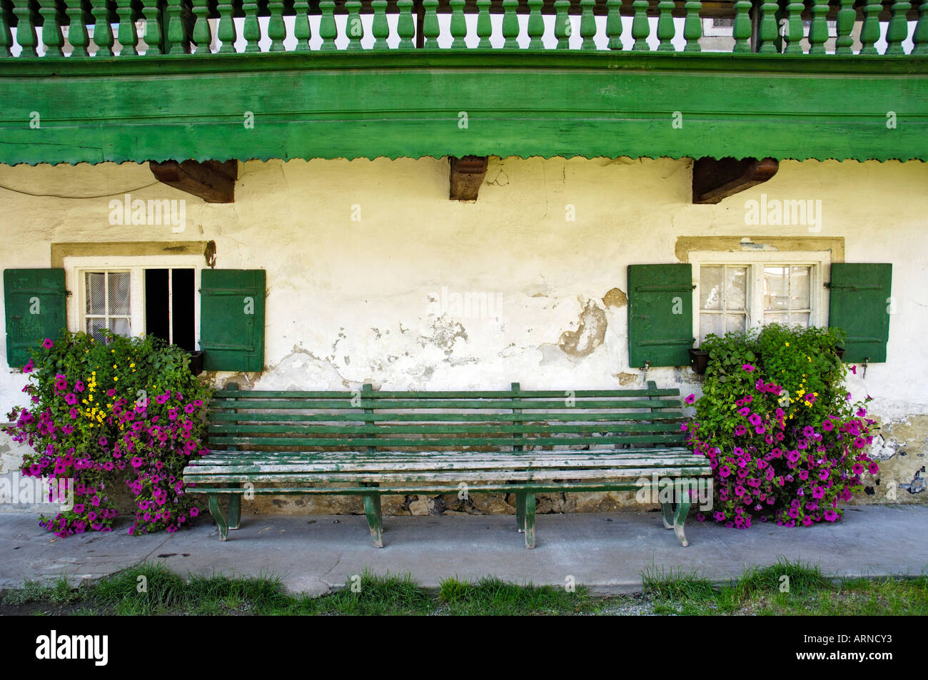 Garden bench in front of farm house, foothills of the Alps, Egling ...