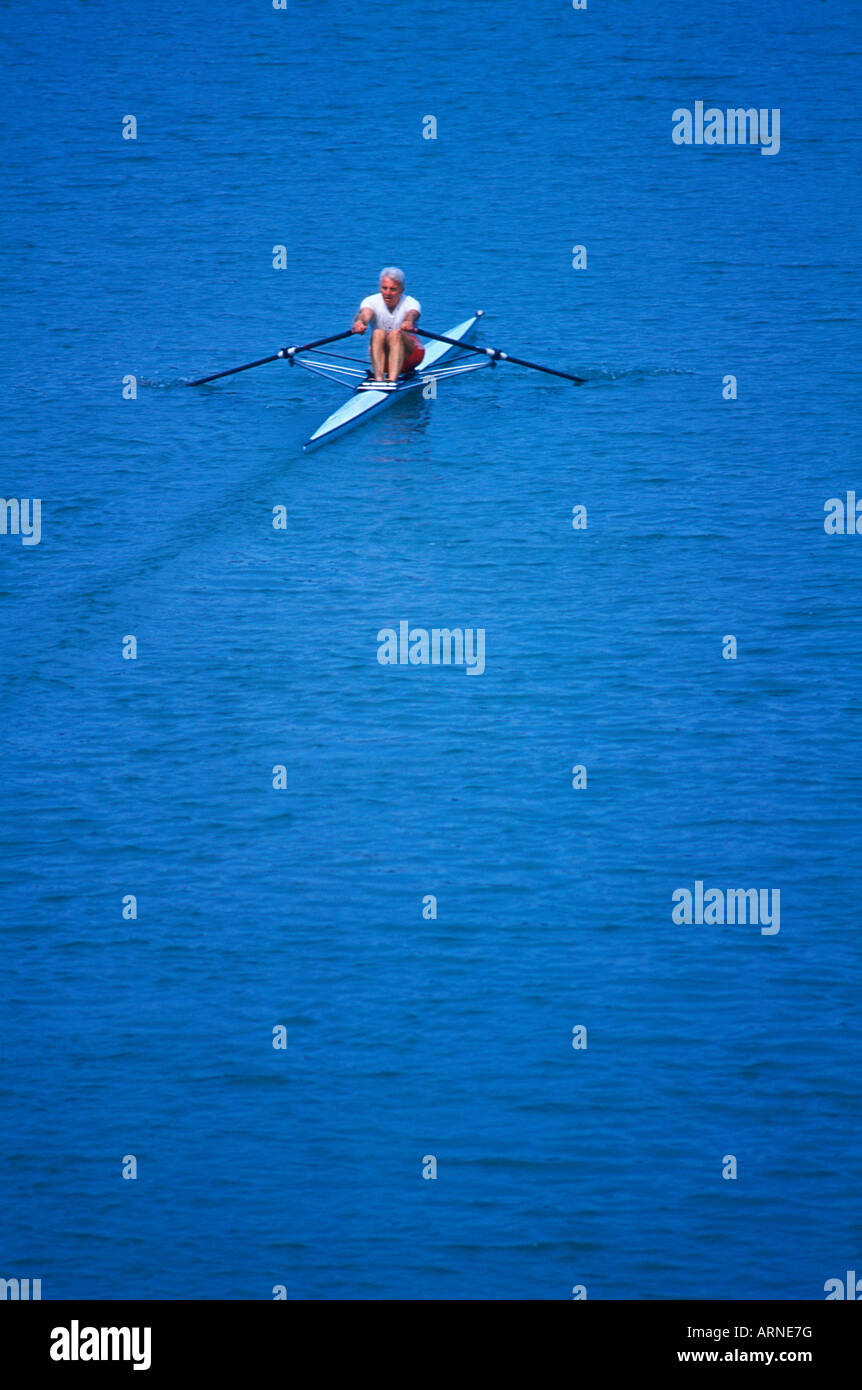 Older man in single rowing shell, British Columbia, Canada Stock Photo ...