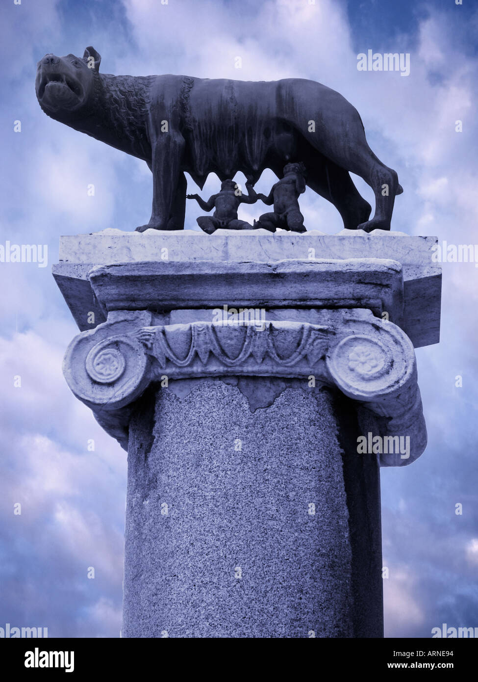 bronze sculpture of Romulus and Remus and the wolf on a marble column ...