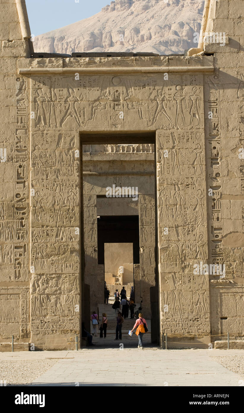 View at the entrance of temple Medinat Habu in front of the mountains ...