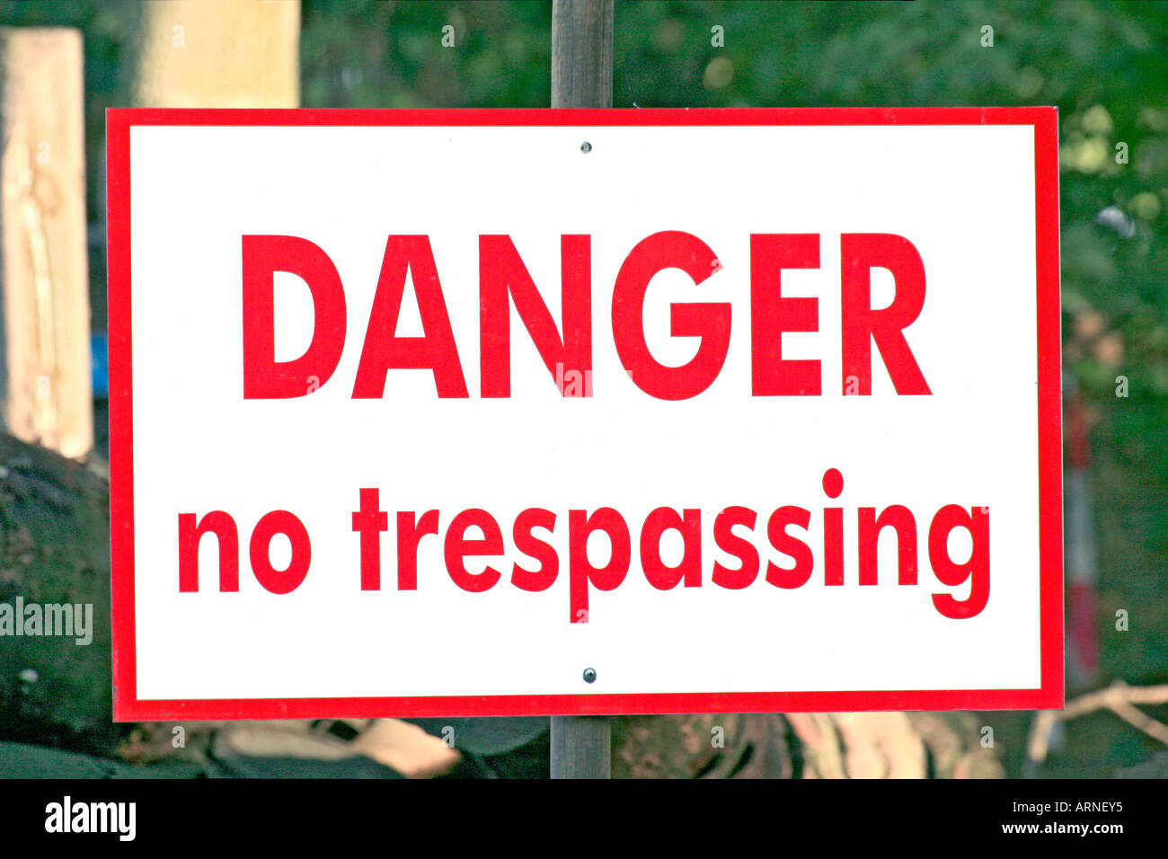 Sign danger no trespassing Stock Photo - Alamy