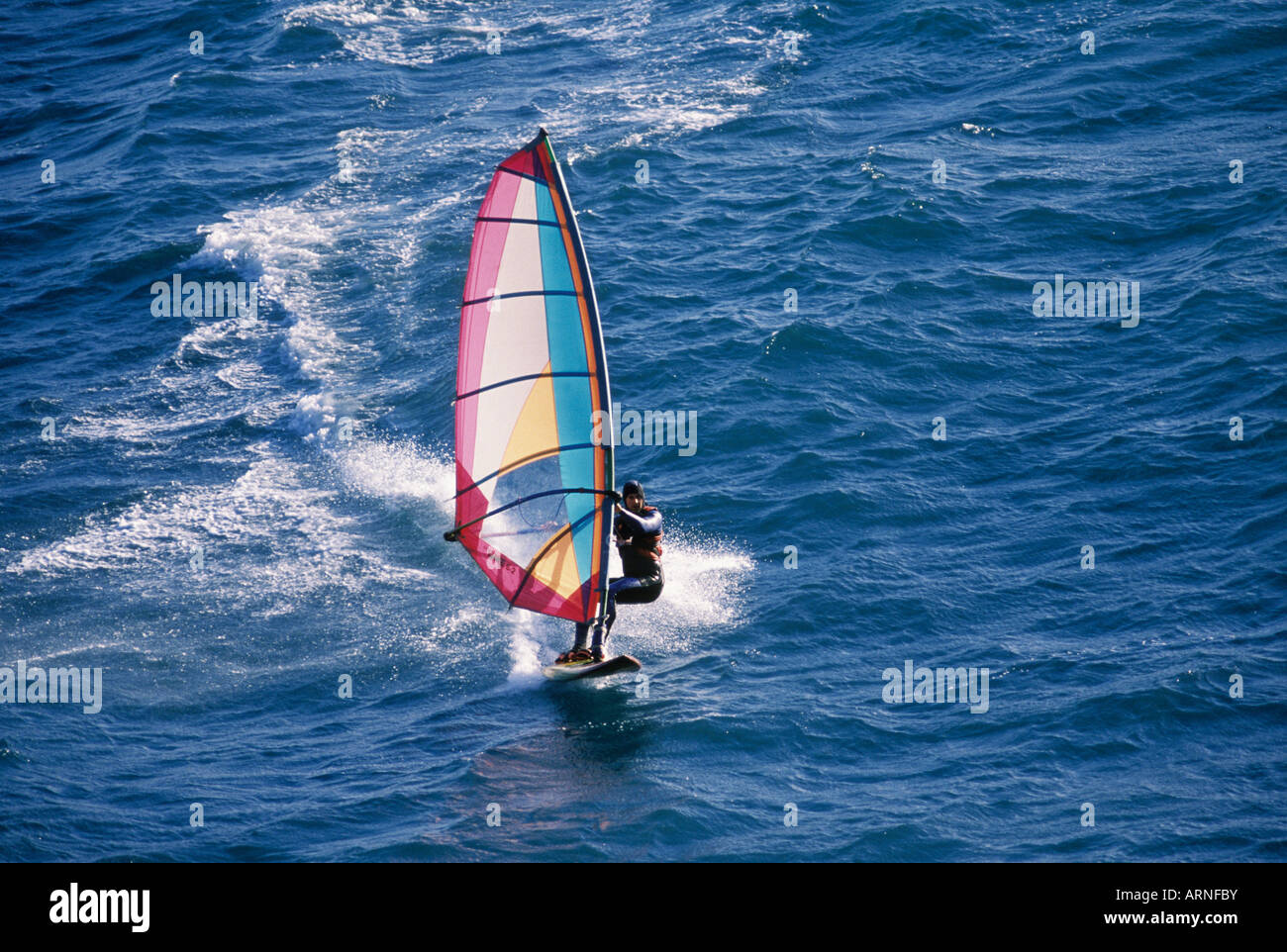 Sailboard cuts across wave, British Columbia, Canada Stock Photo - Alamy