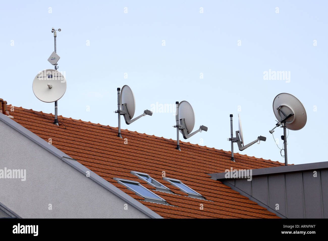 Satellite dishes on roof Stock Photo - Alamy