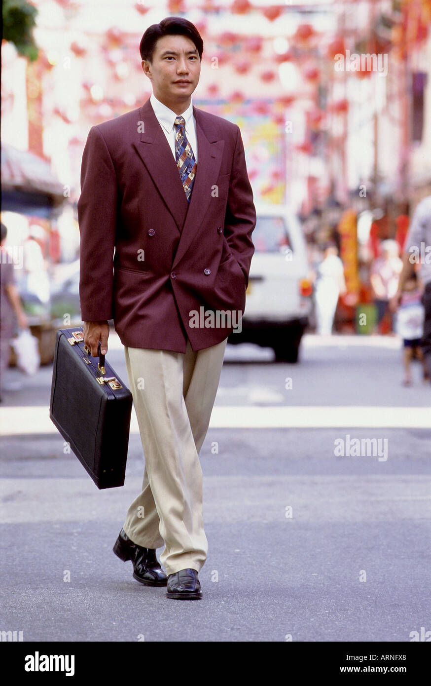 Business man carrying papers hi-res stock photography and images - Alamy