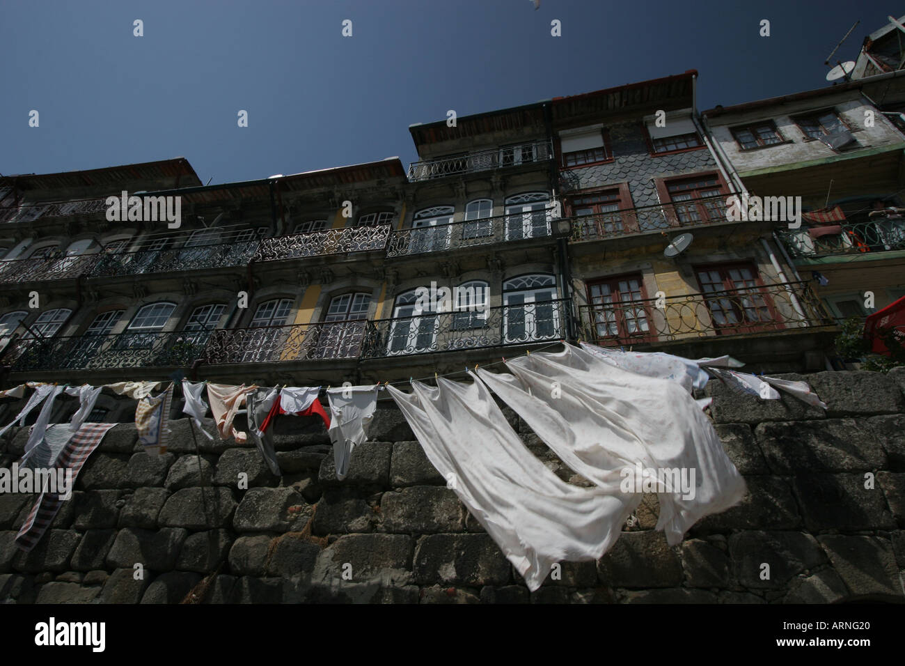 washing line with clothes blowing in the wind buildings in the ...