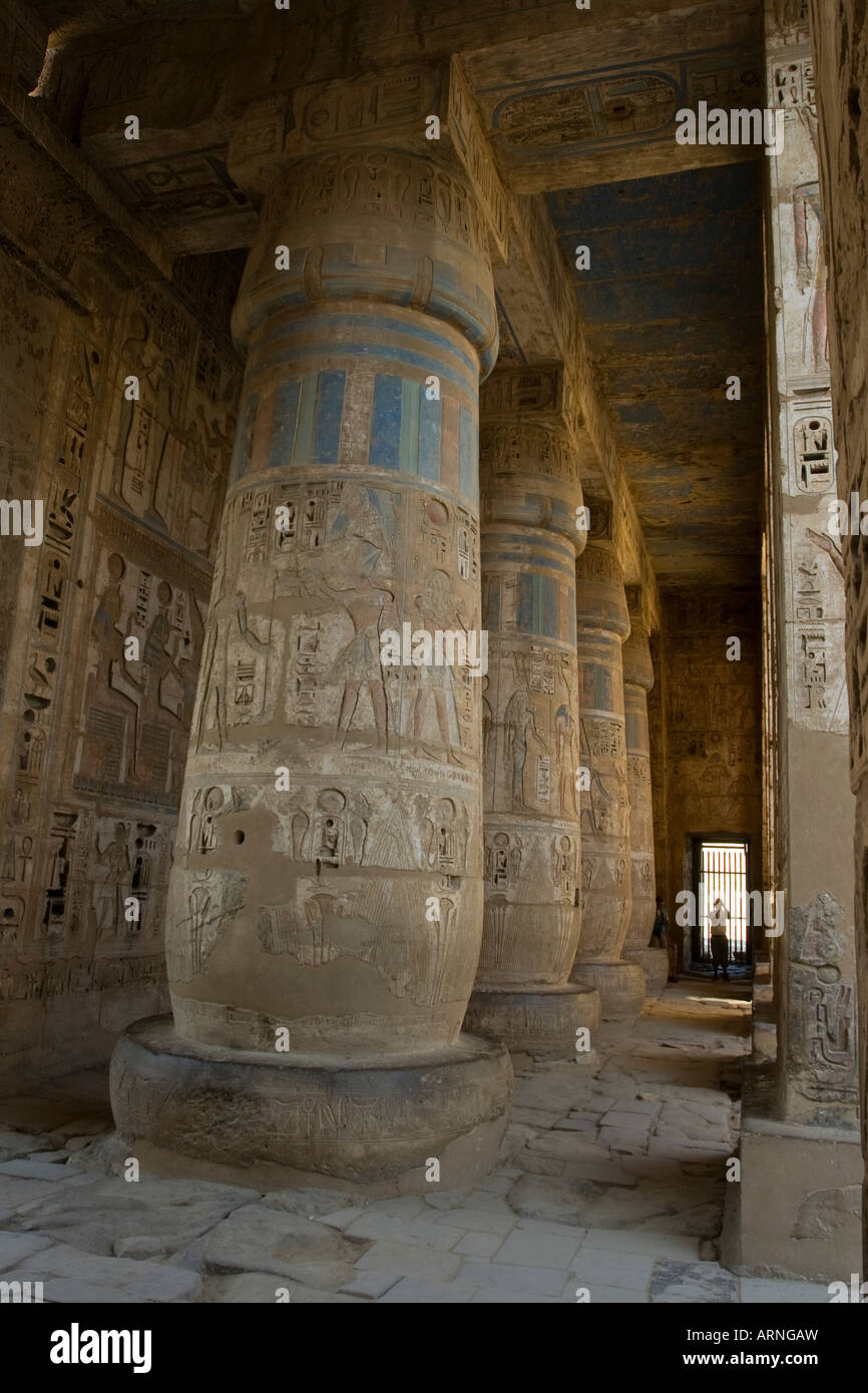 Coloured columns with reliefs and hieroglyps at temple Medinat Habu ...