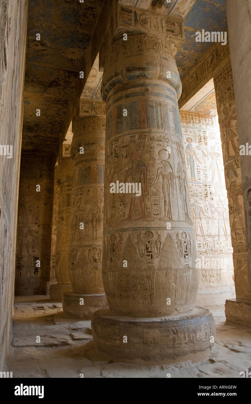 Coloured columns with reliefs at court of temple Medinat Habu Luxor ...