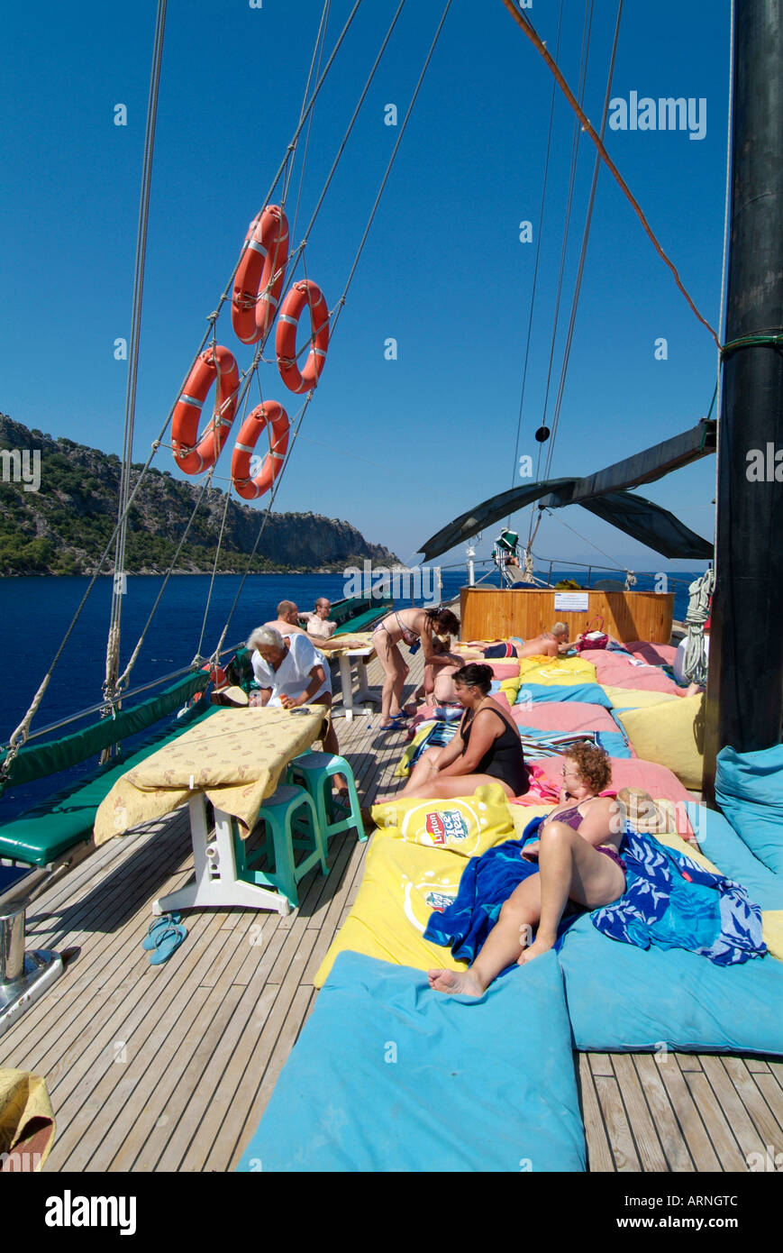 Sun bathe suntan relax deck sleep Gulet Yacht yachting sail boat Turk ...