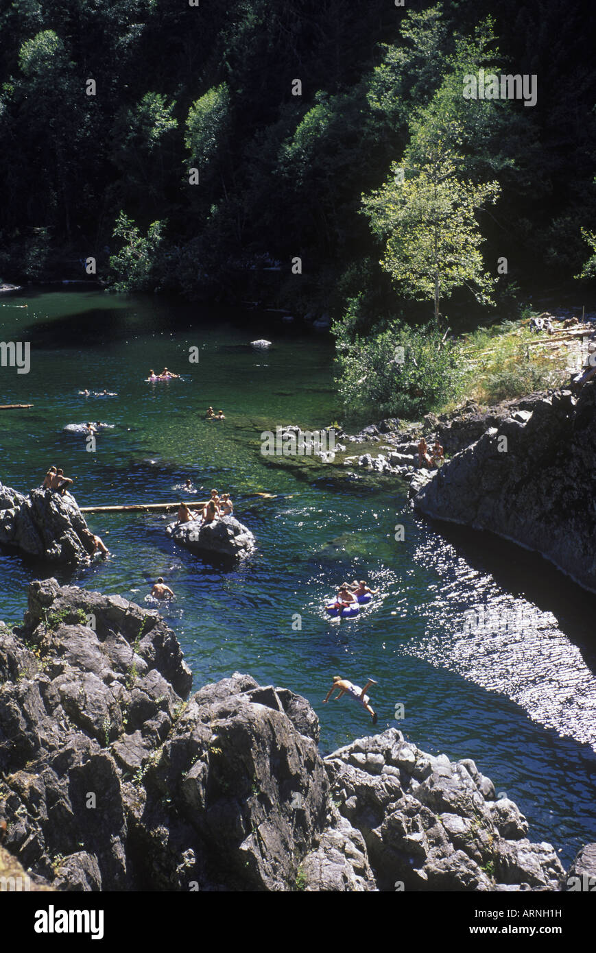Swimmers in summer at Sooke Potholes, Sooke River, Vancouver Island ...