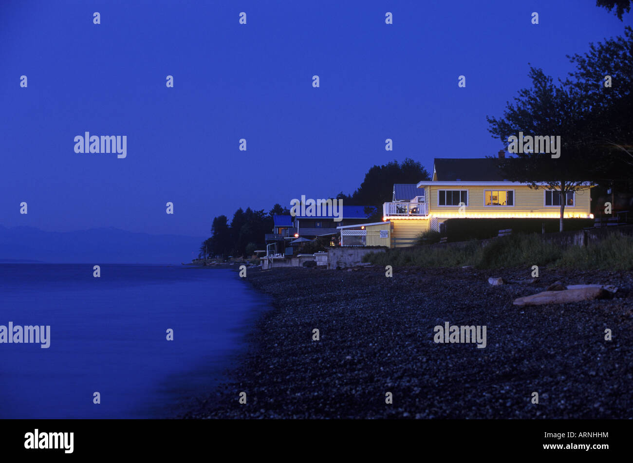 Qualicum Beach Beachfront buildings glow at dusk, Vancouver Island ...