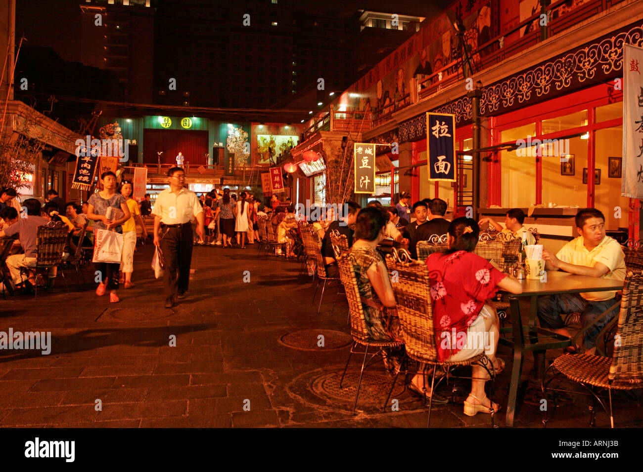 Open air restaurant by Wangfujing Dajie shopping street at night in ...