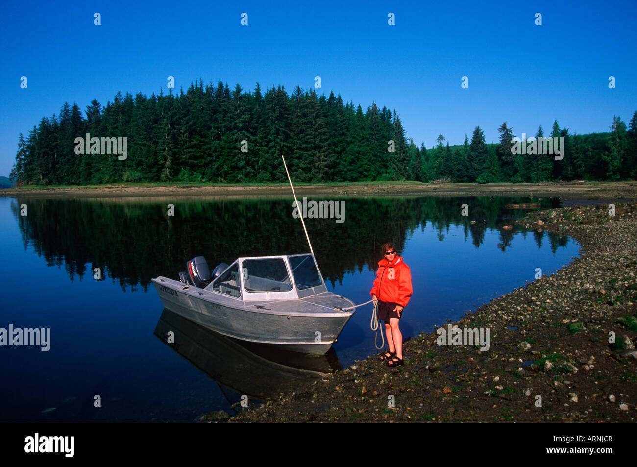 Shore scene with boat and boater hi-res stock photography and images ...