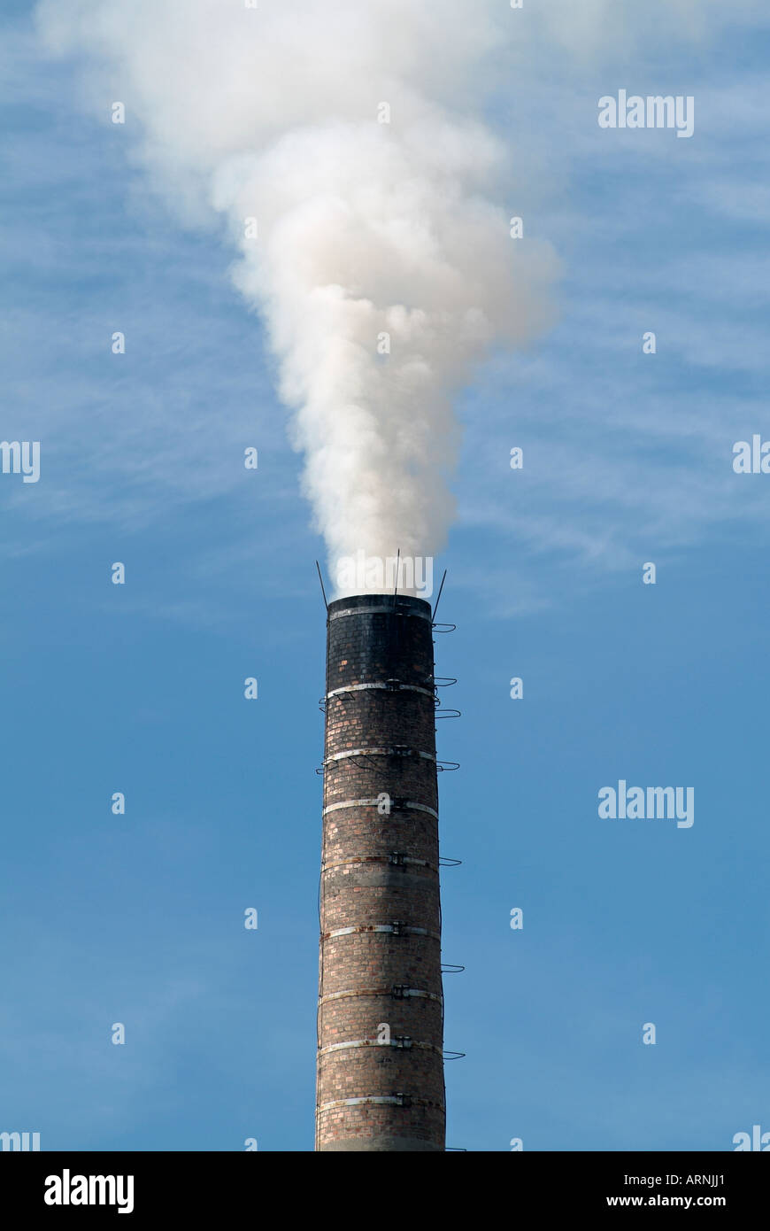 Factory Chimney Pumping Pollution Into the Atmosphere Stock Photo - Alamy