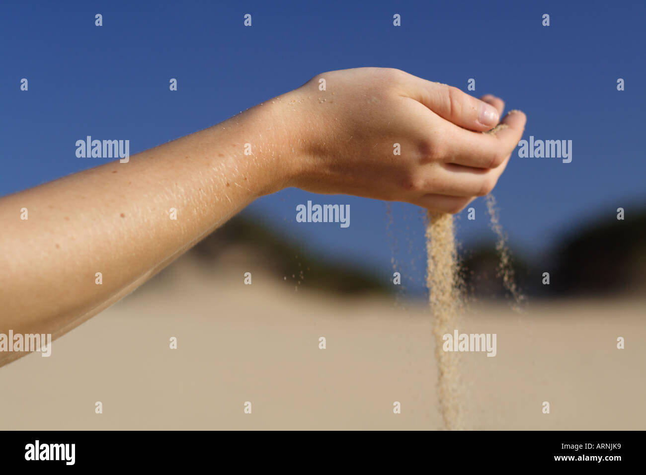 Sand Falling Through Hands High Resolution Stock Photography and Images ...