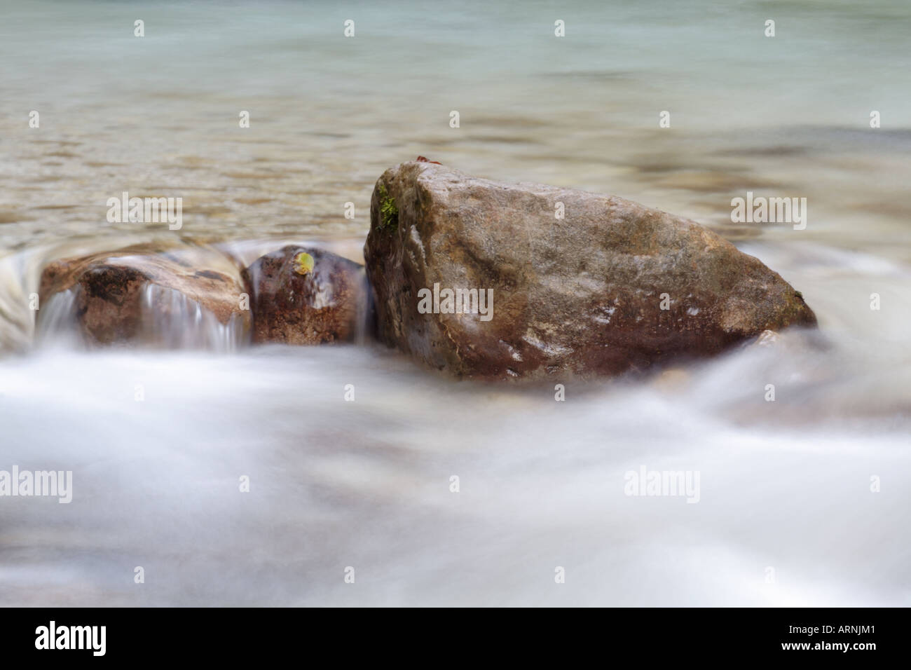 Water running over a rock Stock Photo - Alamy