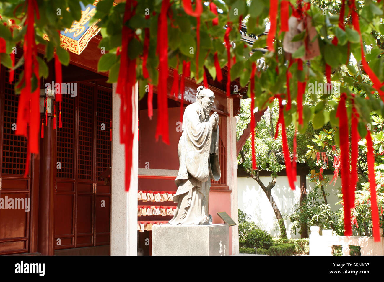 Statue of Confucius and prayer ribbons at the Confucius temple in ...