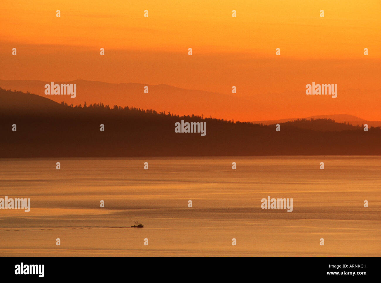 Fishing Troller on the Haro Strait with layered hills beyond, Victoria ...