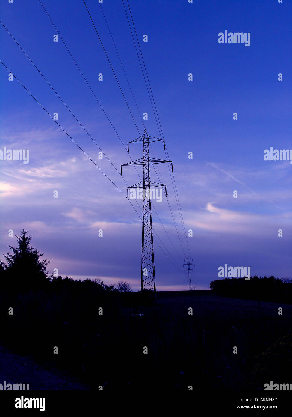 Powerlines at night Stock Photo - Alamy