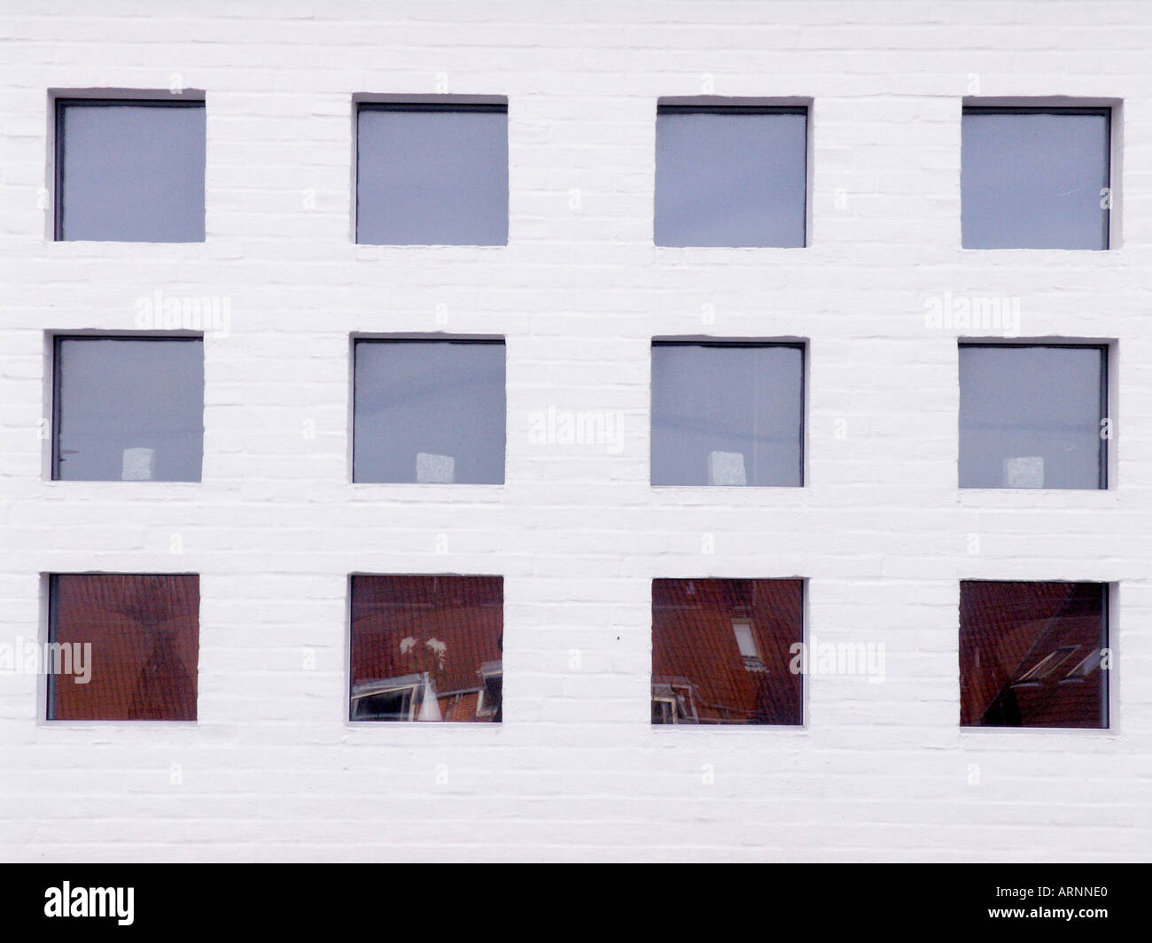 White Wall with many windows in a modern building Stock Photo - Alamy