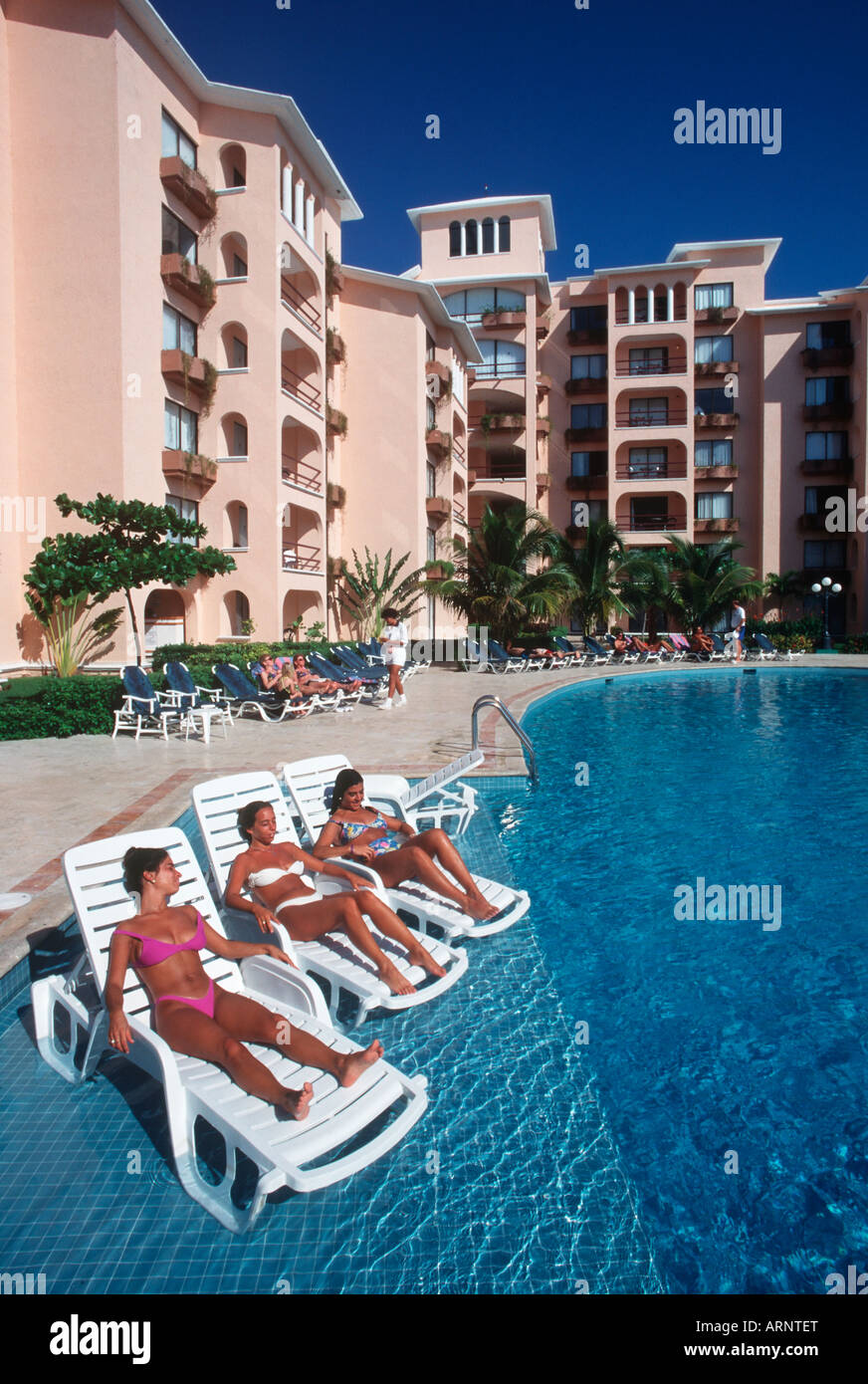 Mexico, Yucatan Peninsula, Carribean Resort at Cancun, three young ...