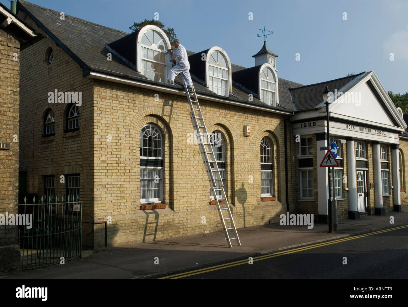 MAN UP A LADDER MAN UP A LADDER PAINTING A WINDOW FRAME SAFFRON WALDEN ...