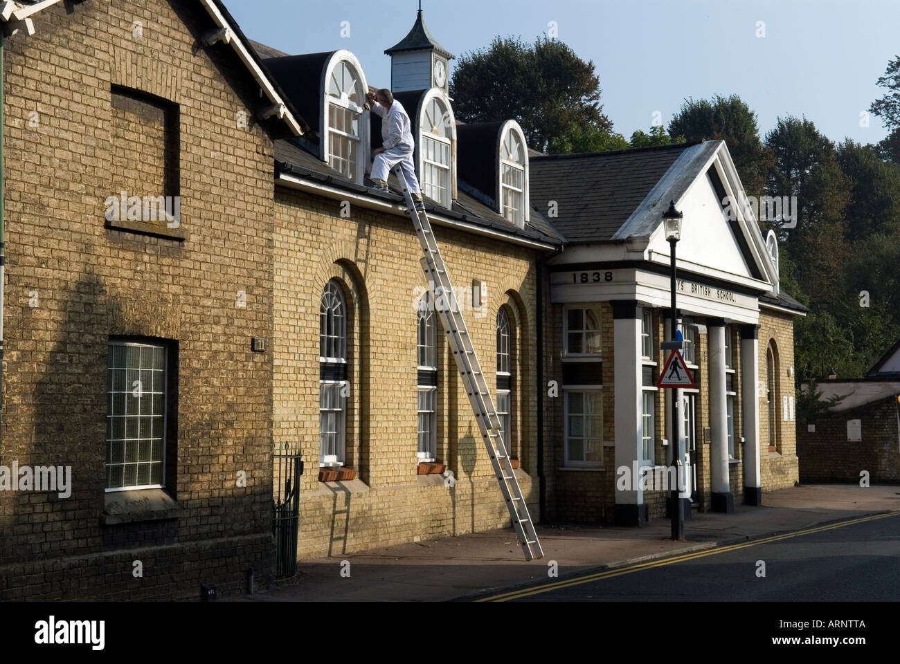 MAN UP A LADDER MAN UP A LADDER PAINTING A WINDOW FRAME SAFFRON WALDEN ...