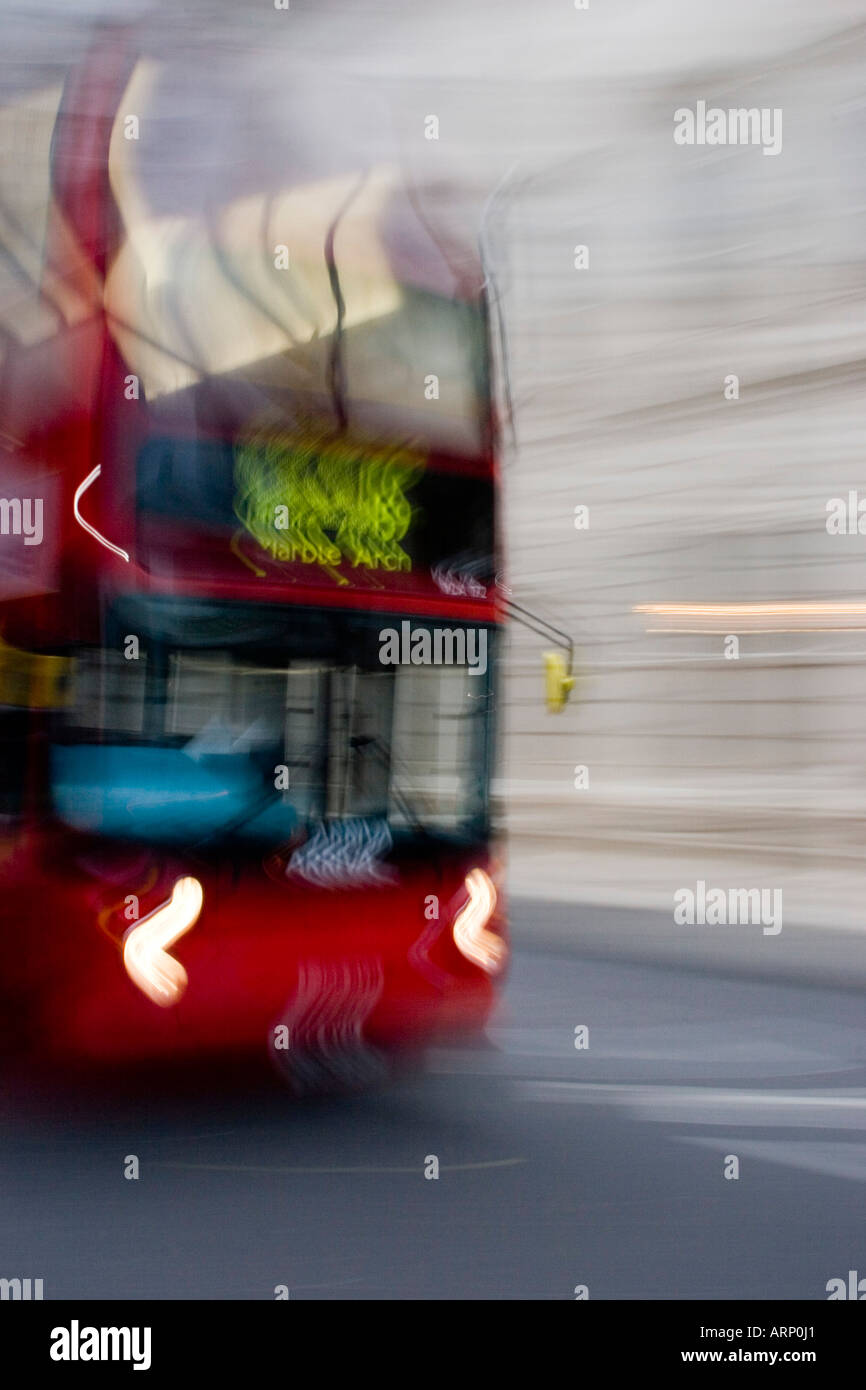 Double decker bus racing through London City Stock Photo - Alamy
