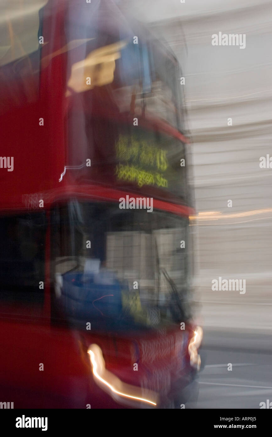 Double decker bus racing though London City Stock Photo - Alamy