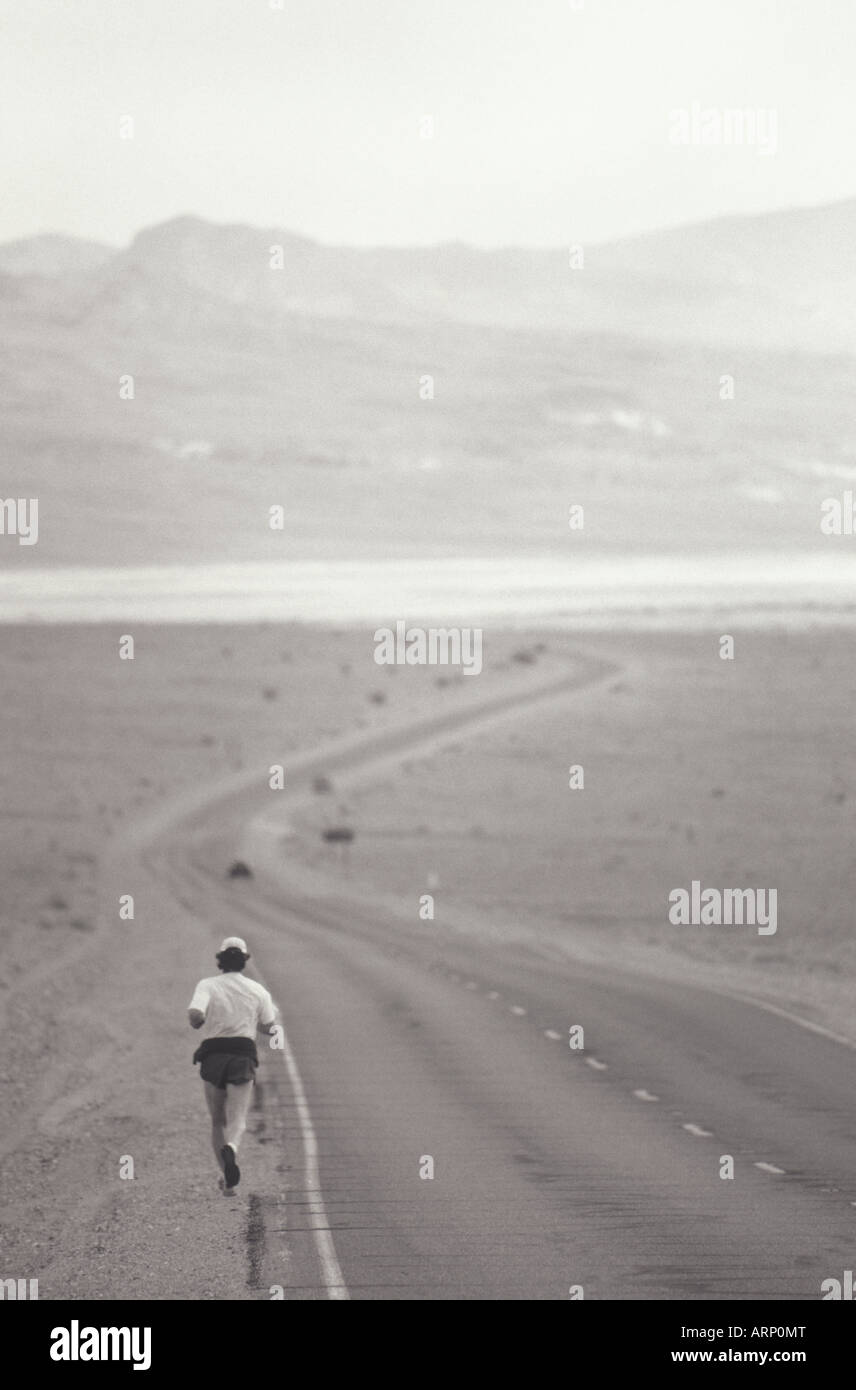 Man running in desert at Death Valley, California, USA Stock Photo - Alamy