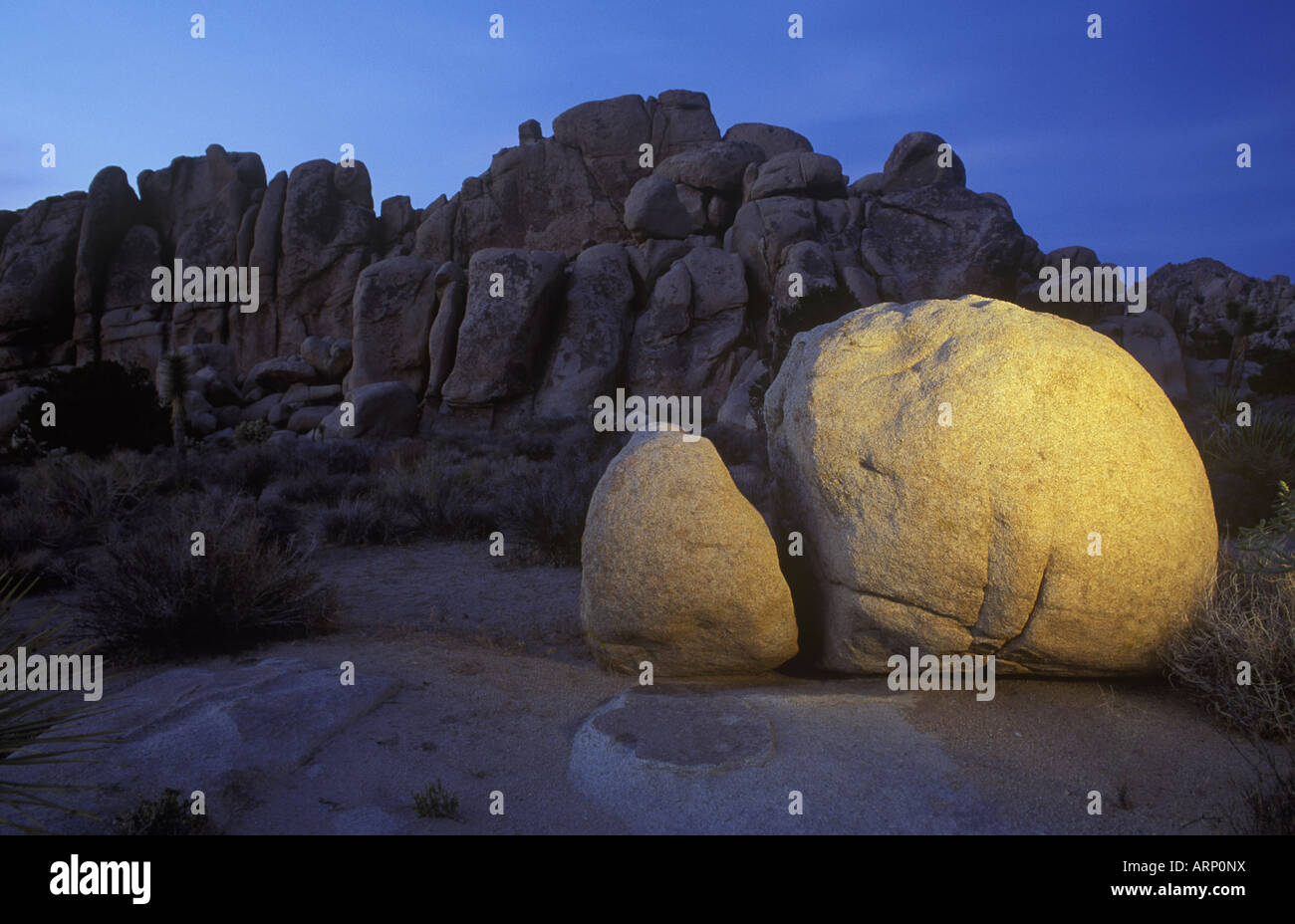 Light painted rocks at twilight, Joshua Tree National Monument ...
