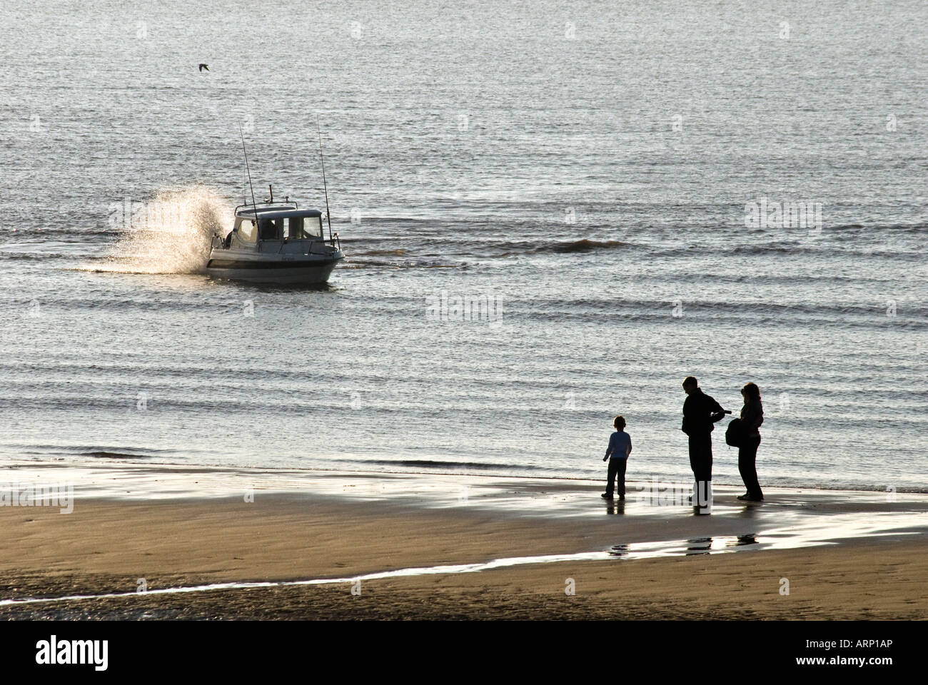View family walkers beached boat Stock Photo - Alamy