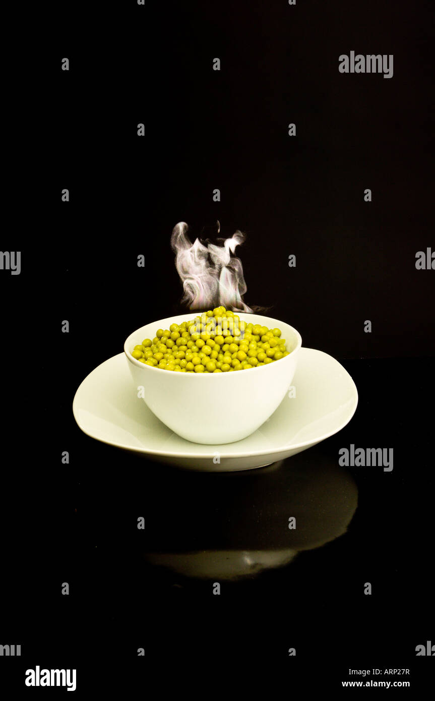 Bowl of hot steaming peas Stock Photo - Alamy