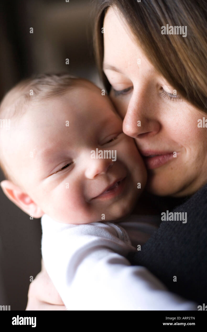 closeup of mother kissing, snuggling newborn infant baby boy Stock ...
