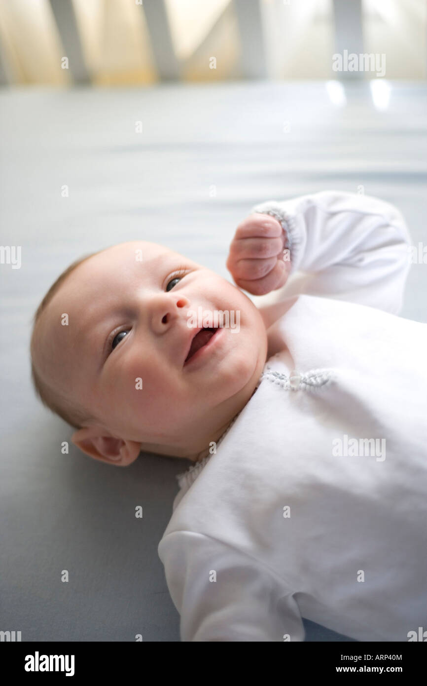 three month old baby smiling in crib Stock Photo - Alamy